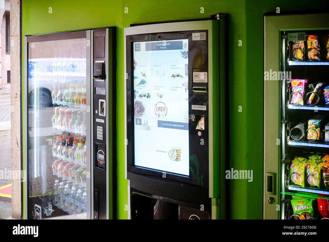 Cremona, Italy - January 30th 2025 Three vending machines are situated ...