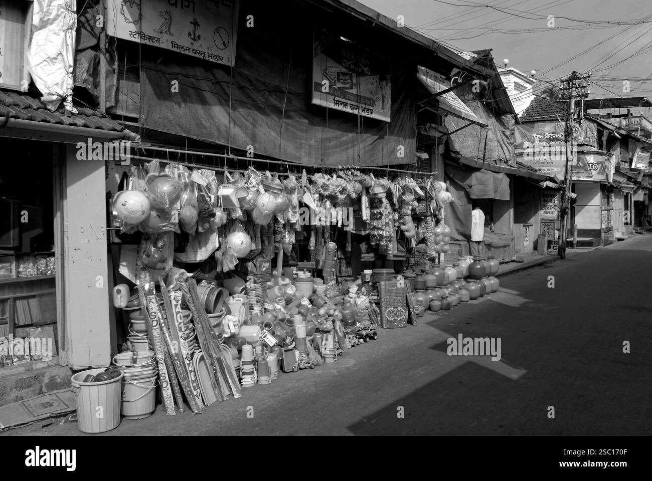 Black and white photo of shop in the market of Malvan district ...
