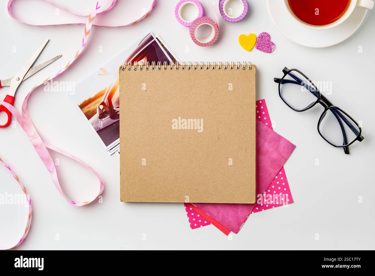 Crafting session with colorful materials and tools on a white table ...