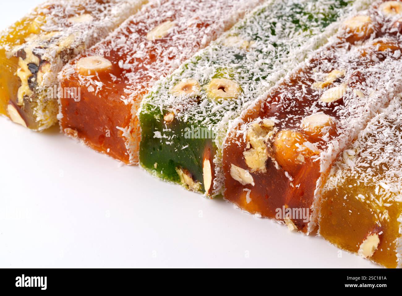 Colorful assortment of traditional Turkish delight with nuts displayed ...