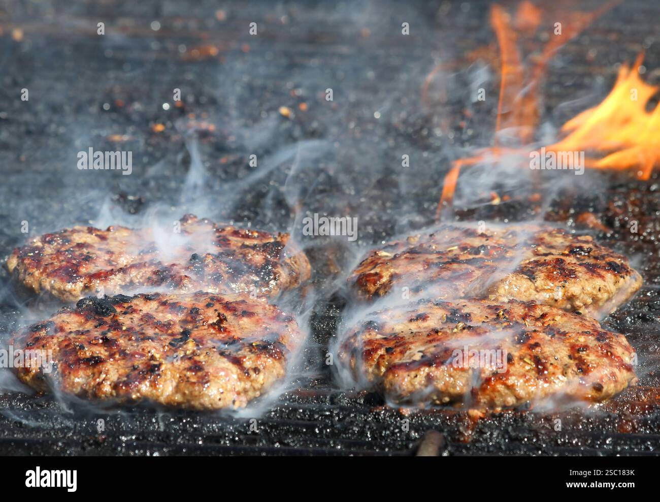 Delicious Burger Patties cooking on Grill in Carmel, IN, USA Stock ...