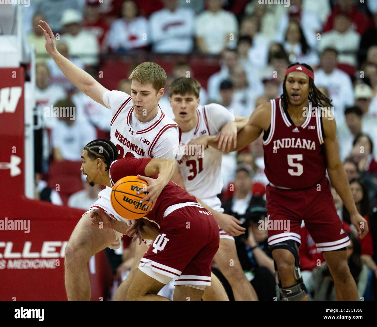 Madison, Wisconsin, USA. 4th Feb, 2025. Indiana's MYLES RICE (left ...