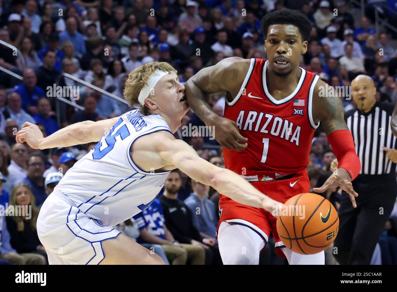 BYU forward Richie Saunders (15) reaches for the ball against Arizona ...