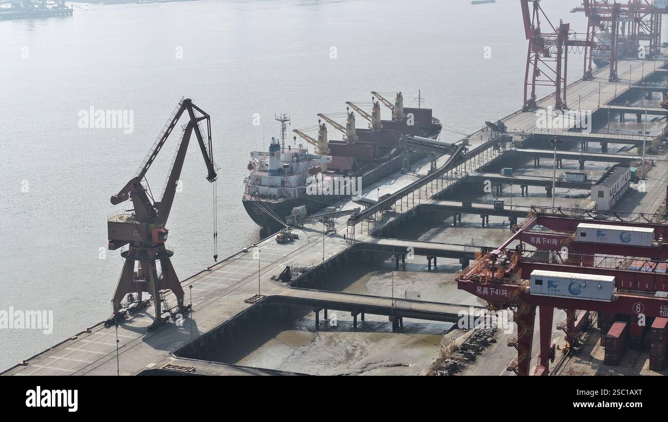 Cargo ships load and unload containers at Qingzhou container terminal ...