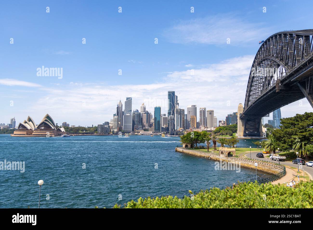 Sydney Opera House and harbour bridge with views across the harbour to ...
