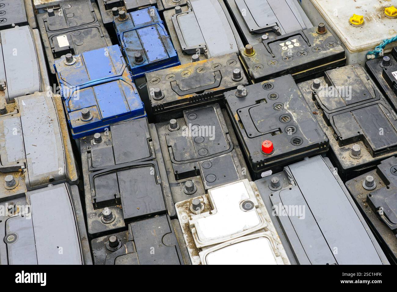 Stack of many used car batteries for recycling in a hazardous waste ...