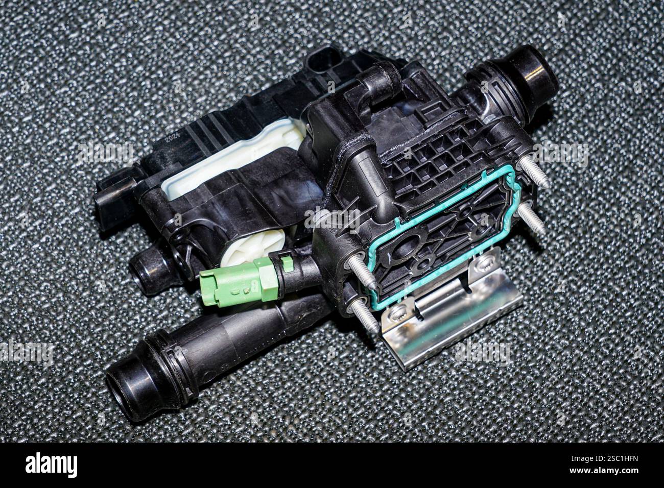 New modern passenger car engine cooling system thermostat in black ...