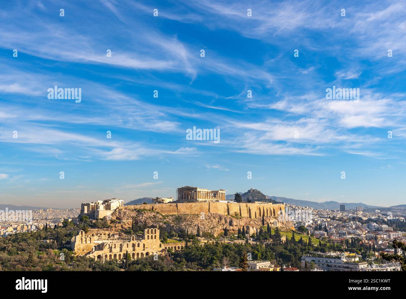 The Acropolis in Athens, Greece on sunny day with scattered clouds ...