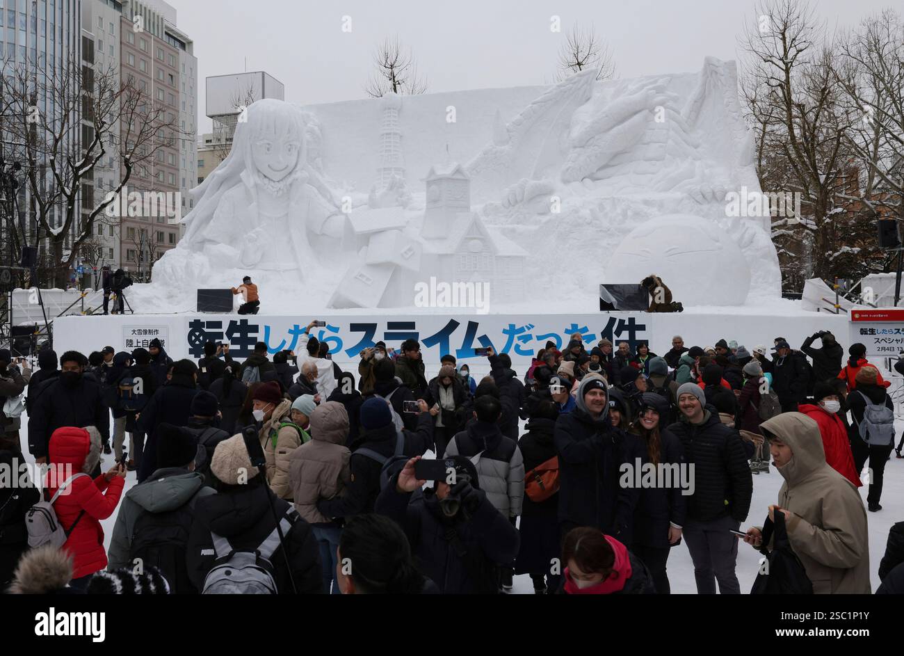 Visitors enjoy snow statues and sculptures at the Sapporo Snow Festival ...