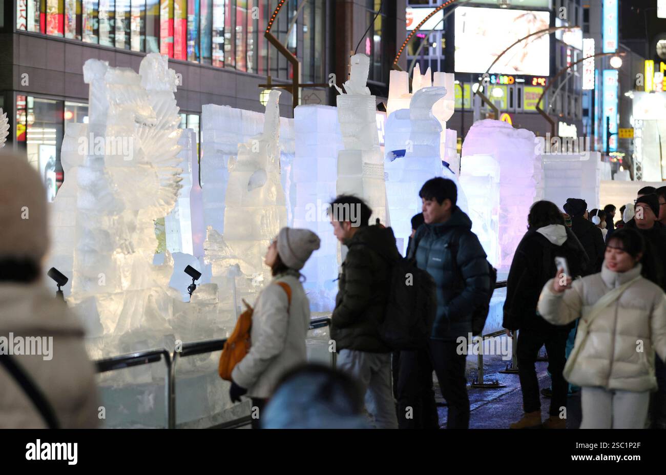 Visitors enjoy Ice sculptures at the Sapporo Snow Festival (Sapporo Yuki-Matsuri) at Susukino in ...