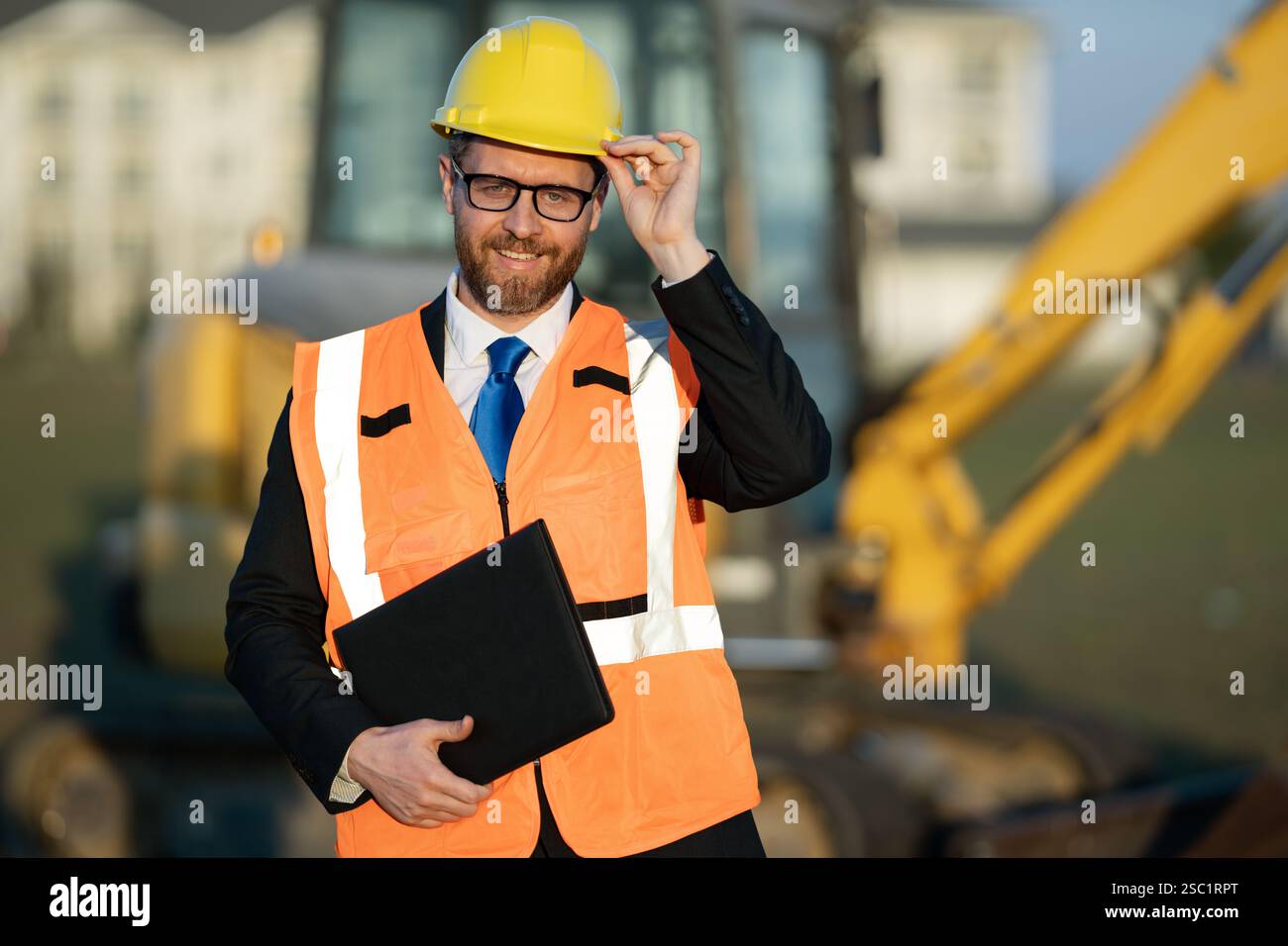 Successful construction business owner. Construction worker in suit and ...