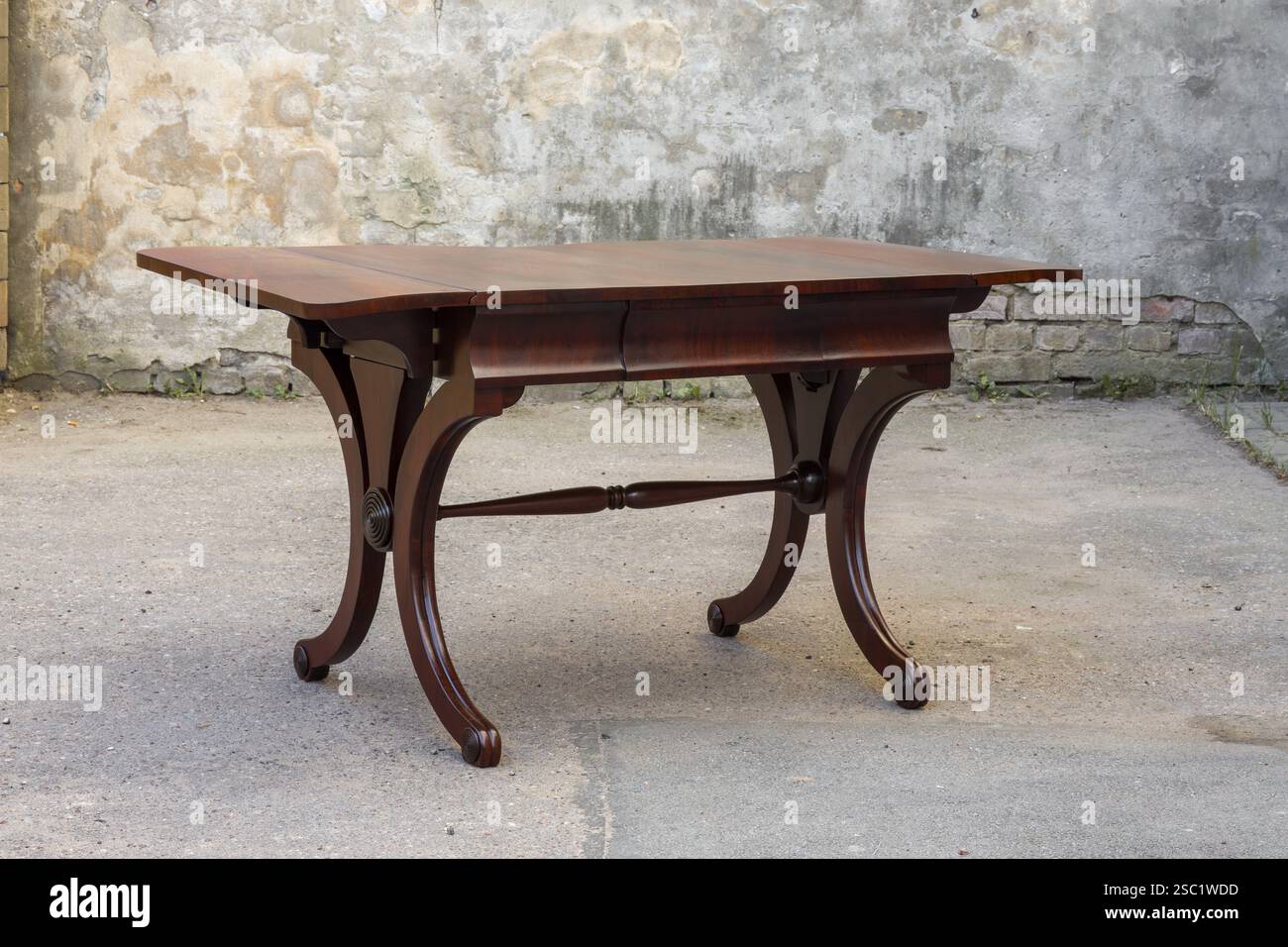 This image showcases a beautifully crafted antique mahogany table with ...