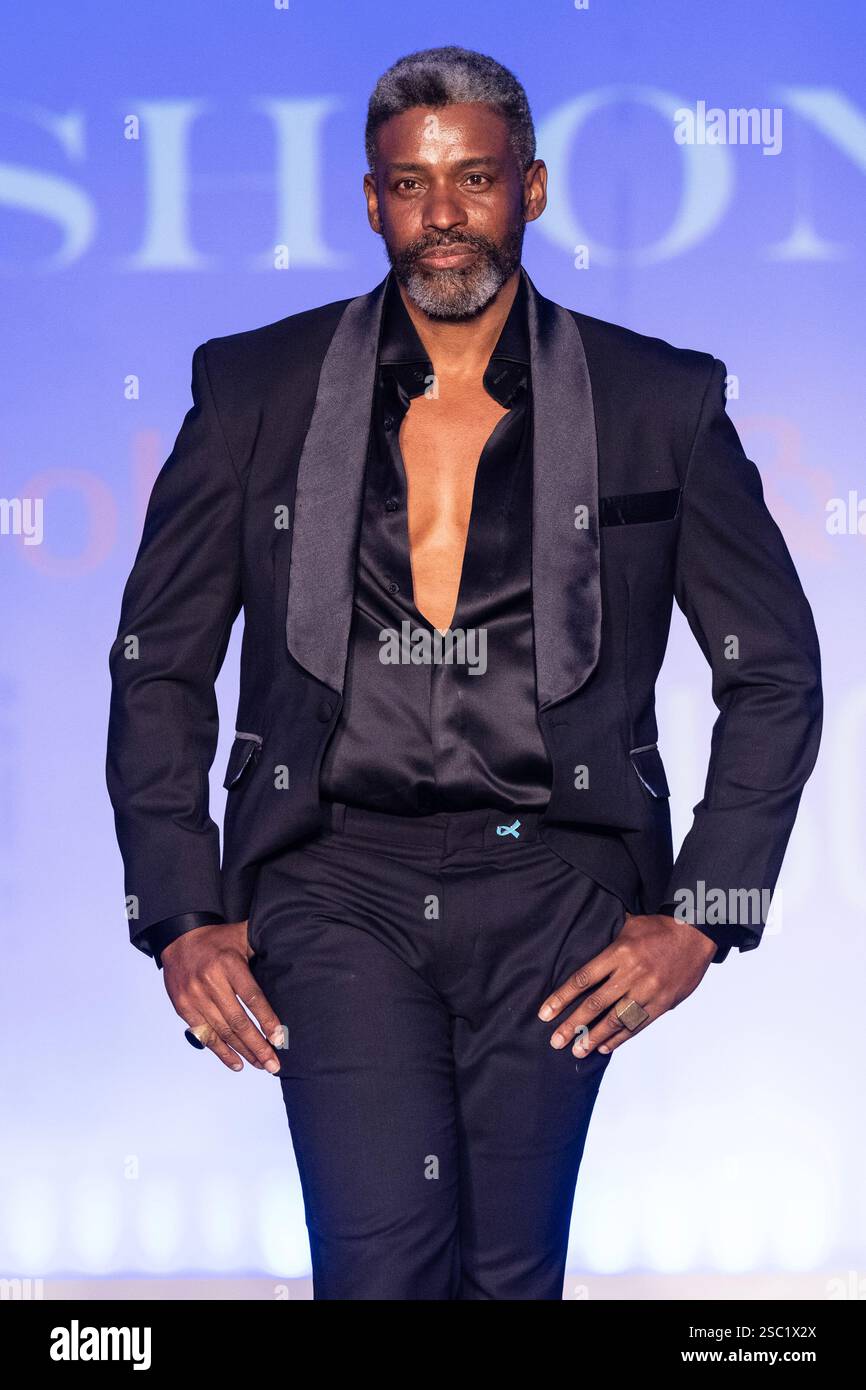 Musa Jackson wearing Edwin D'Angelo walks runway for 9th Annual Blue ...