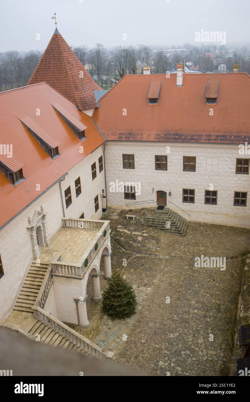 Bauska Castle in Latvia, with its medieval towers and red tiled roof ...