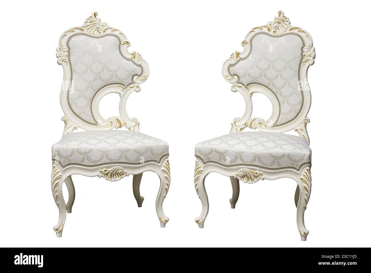 Pair of ornate, light-colored chairs with patterned upholstery and ...