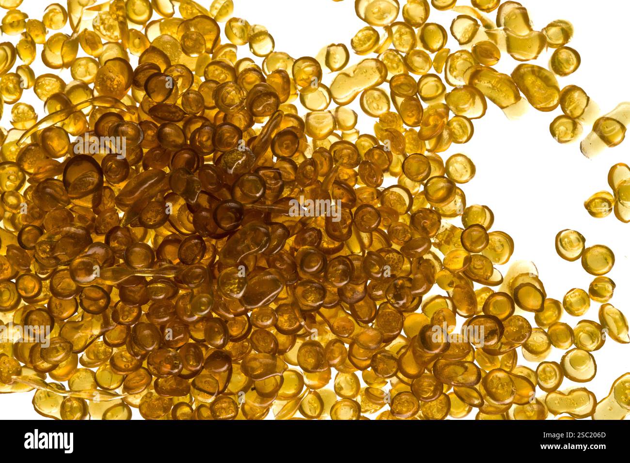 Amber-colored bone glue beads, pearls on a white background Stock Photo ...
