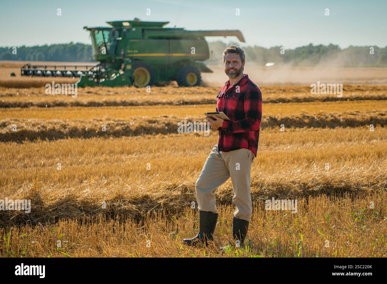 The harvest. Man working in a cultivated field. Traditional farming in ...