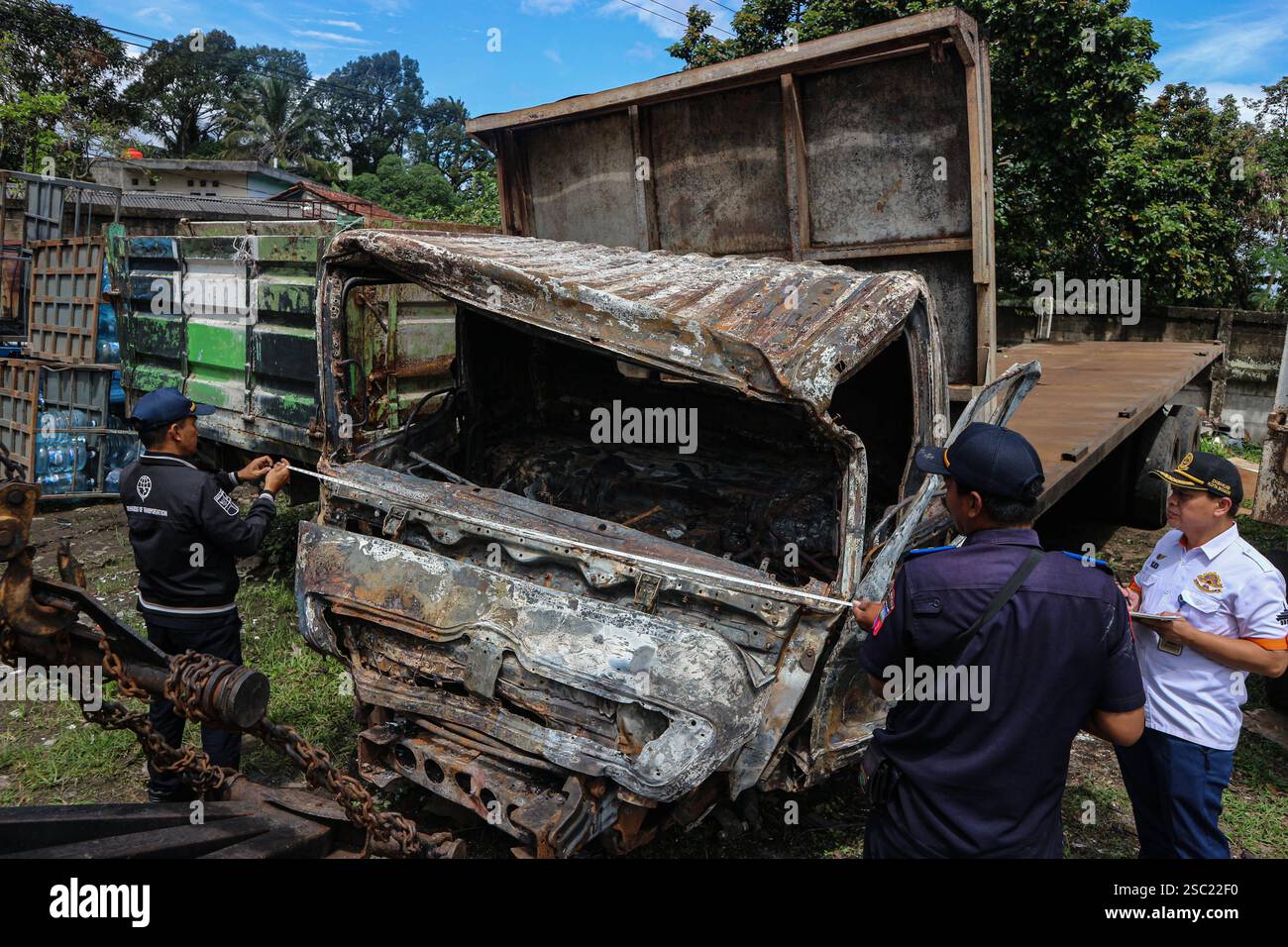 Bogor, Indonesia. 5th Feb, 2025. Officers work with a damaged truck after a traffic accident ...