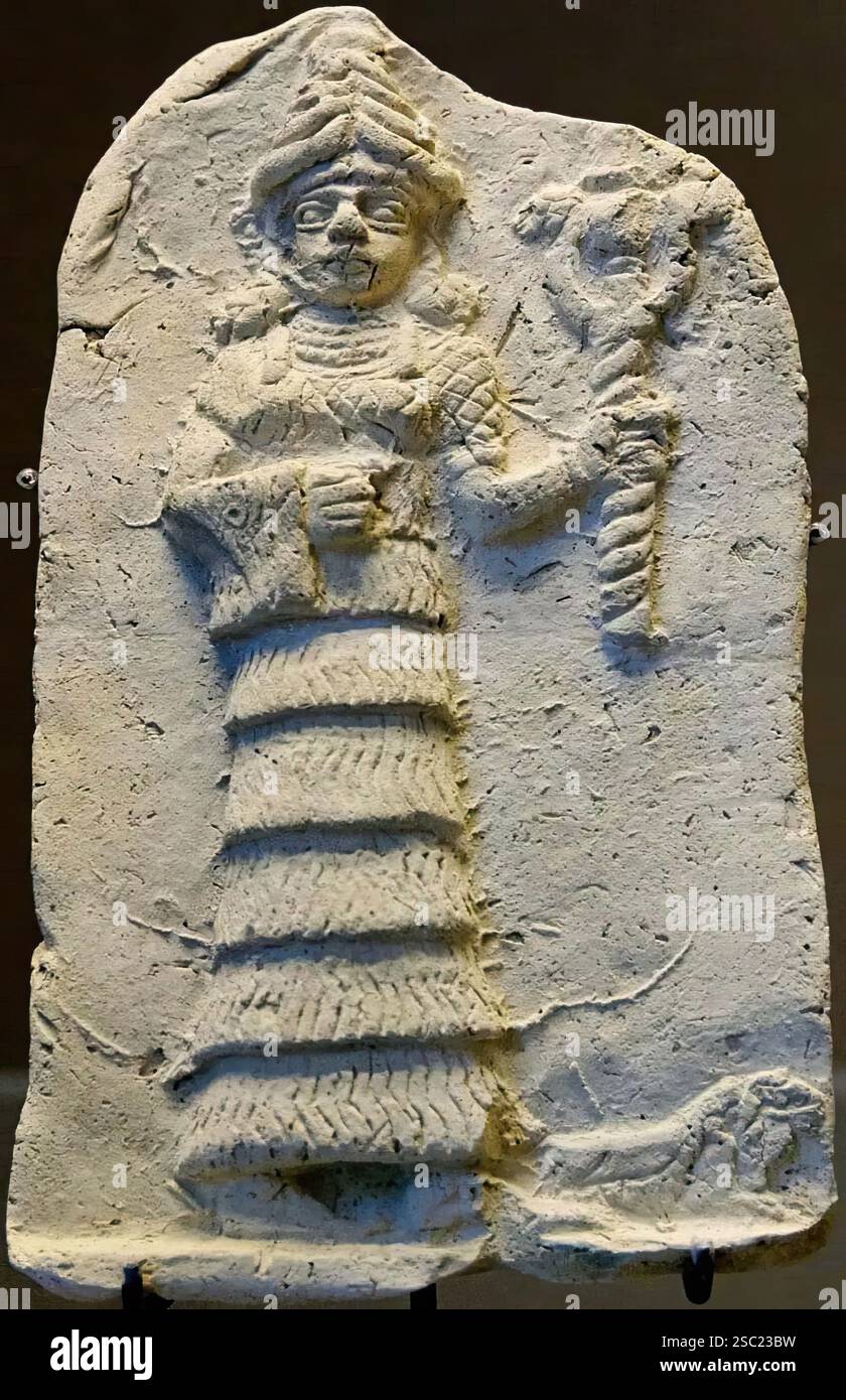 5339. Clay figurine of Ishtar holding a staff representing the symbol ...
