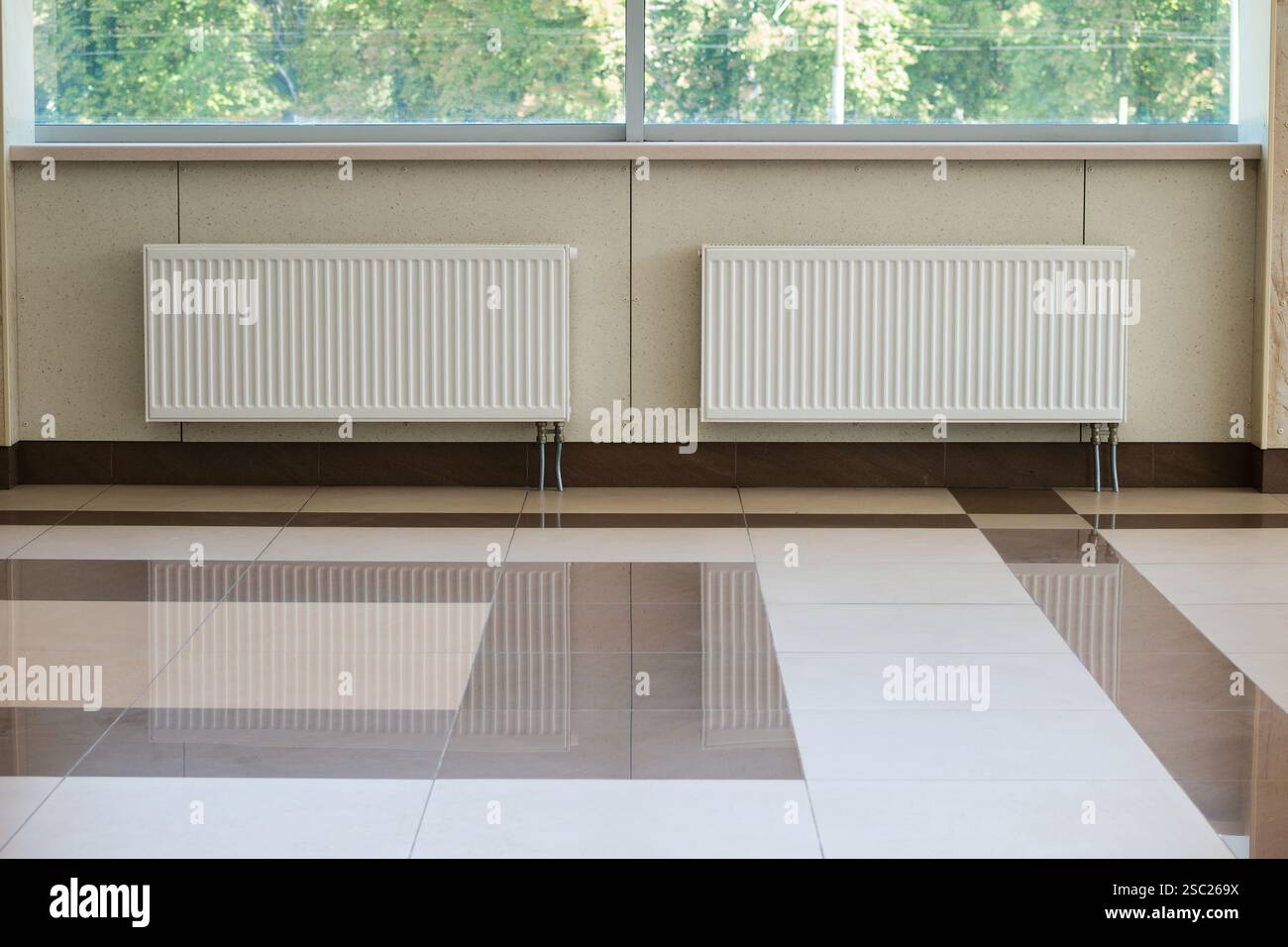 White radiator installed under window hi-res stock photography and ...