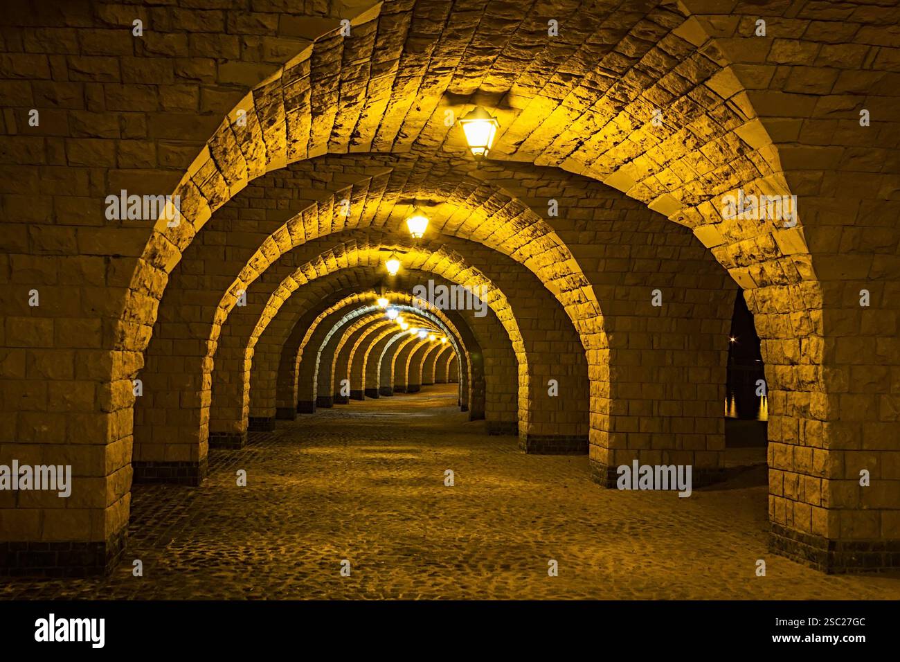 The arched stone colonnade with suspended lanterns Stock Photo - Alamy