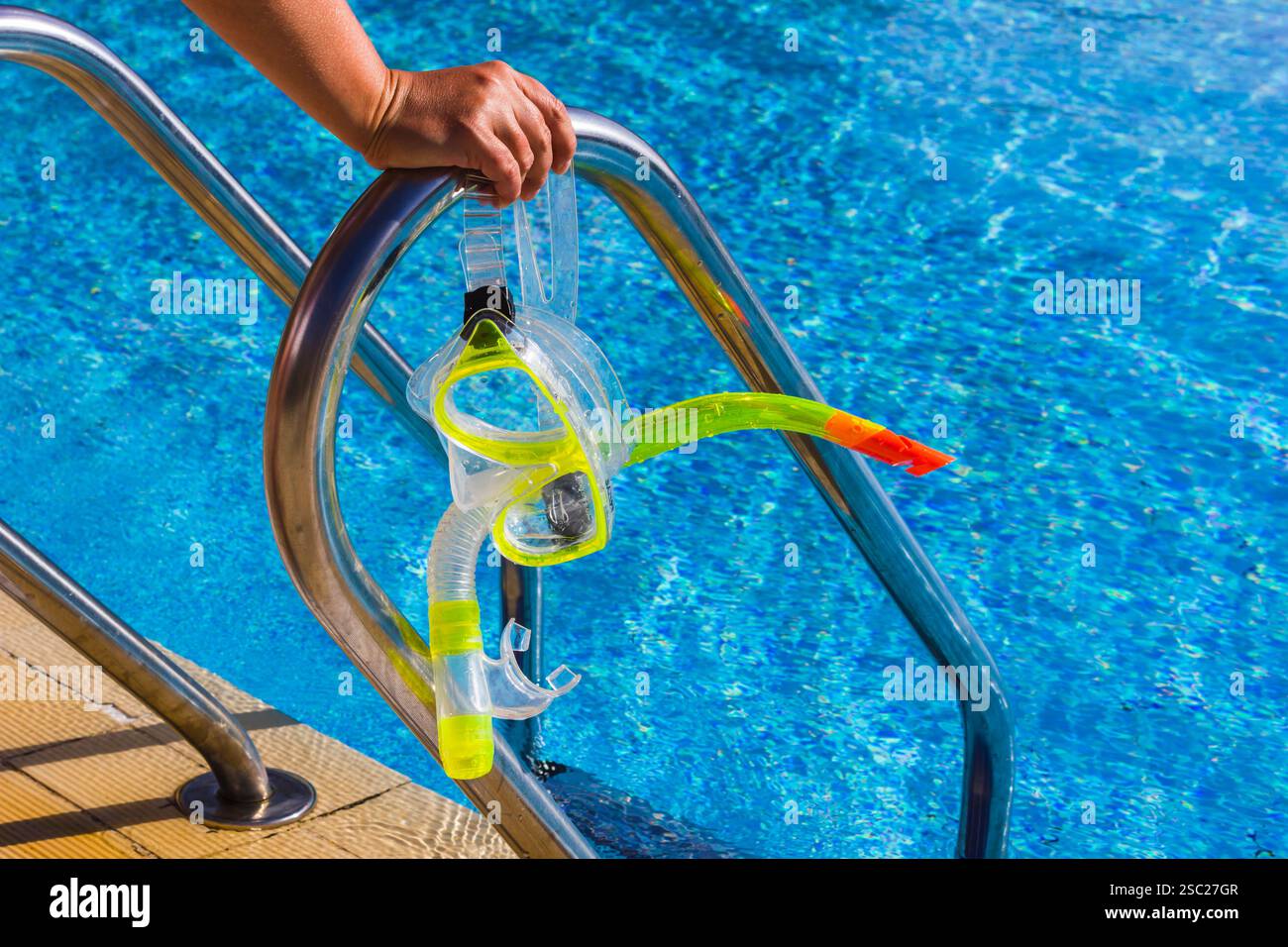 Mask and snorkel for diving near the swimming pool Stock Photo - Alamy