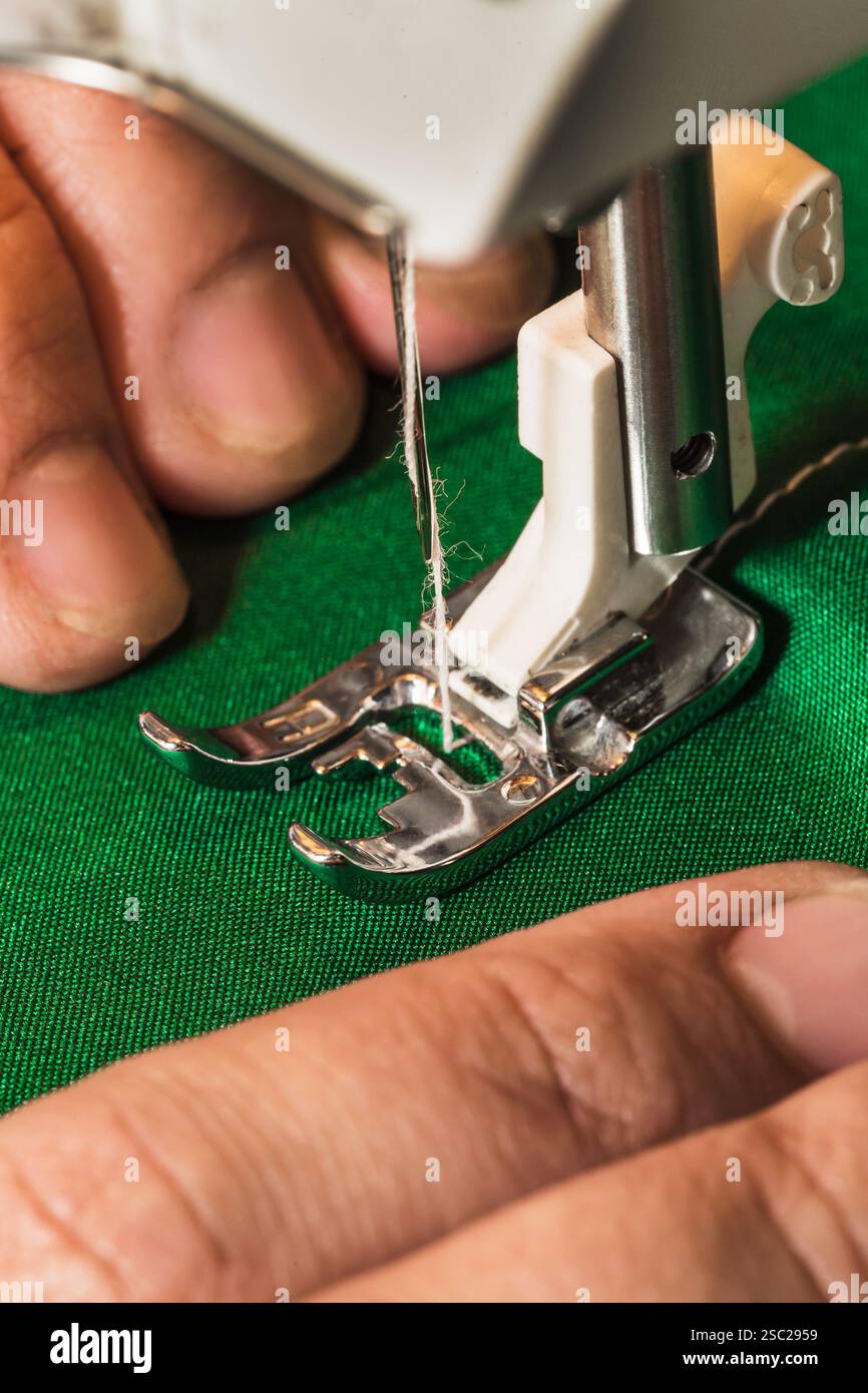 The sewing machine and item of clothing Stock Photo - Alamy
