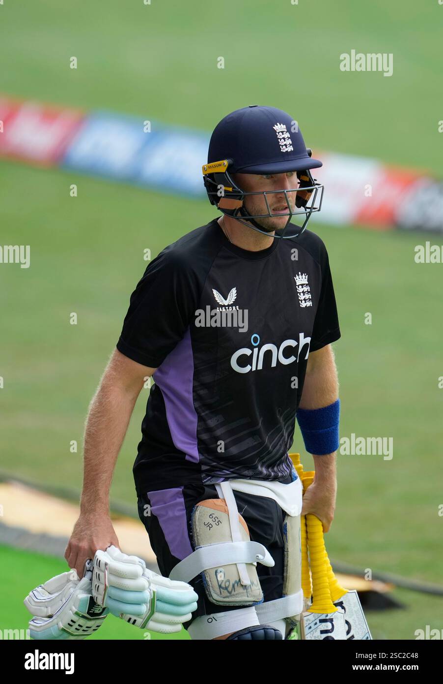 England's Joe Root walks to bat in the nets during a training session ...