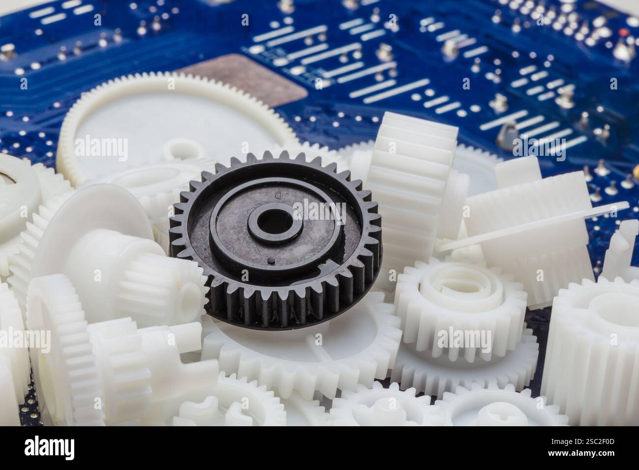The plastic gear. Photo fragment of machine Stock Photo - Alamy