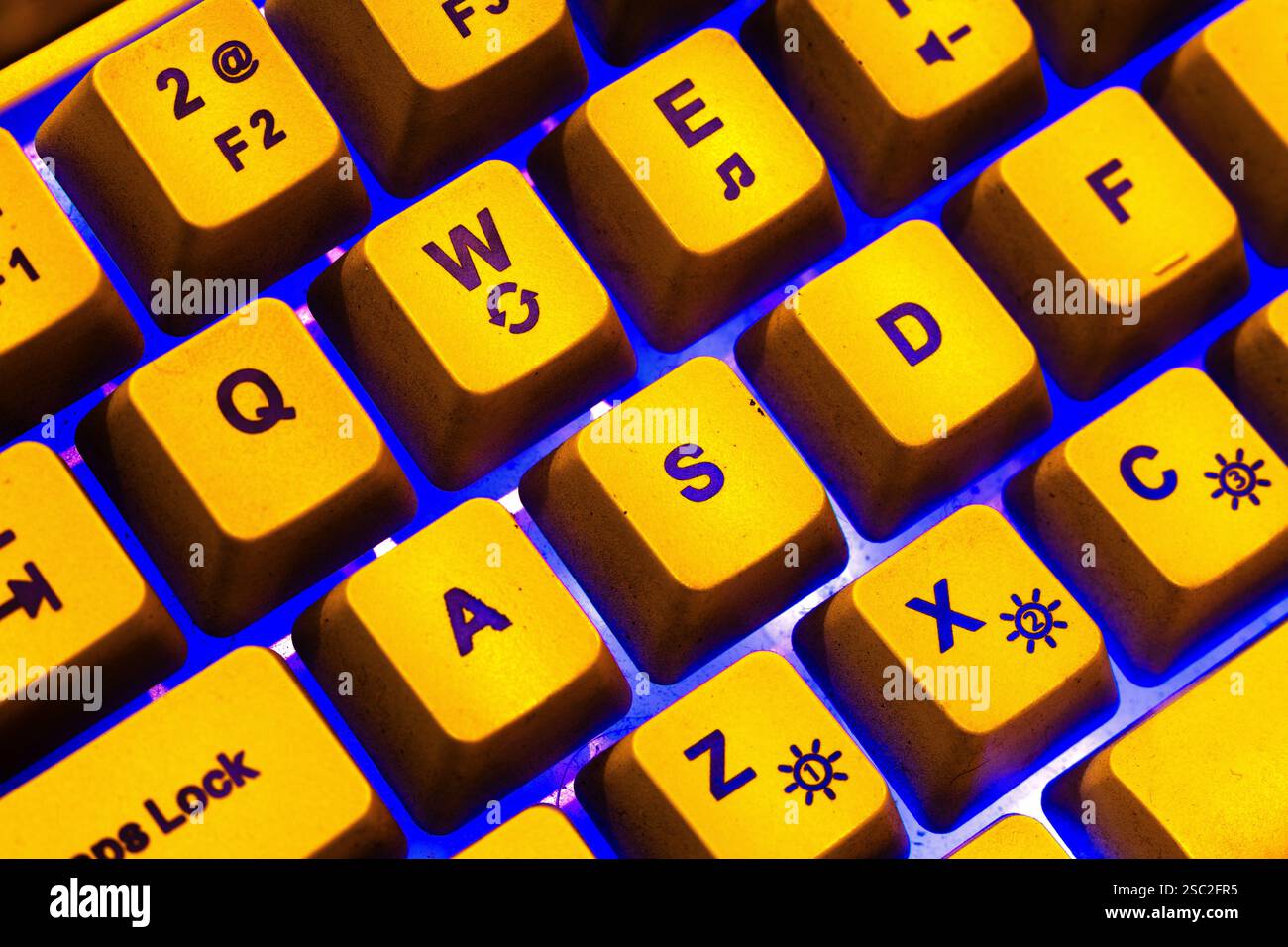 Yellow keyboard with blue light ambience, WASD Keyboard keys Stock ...