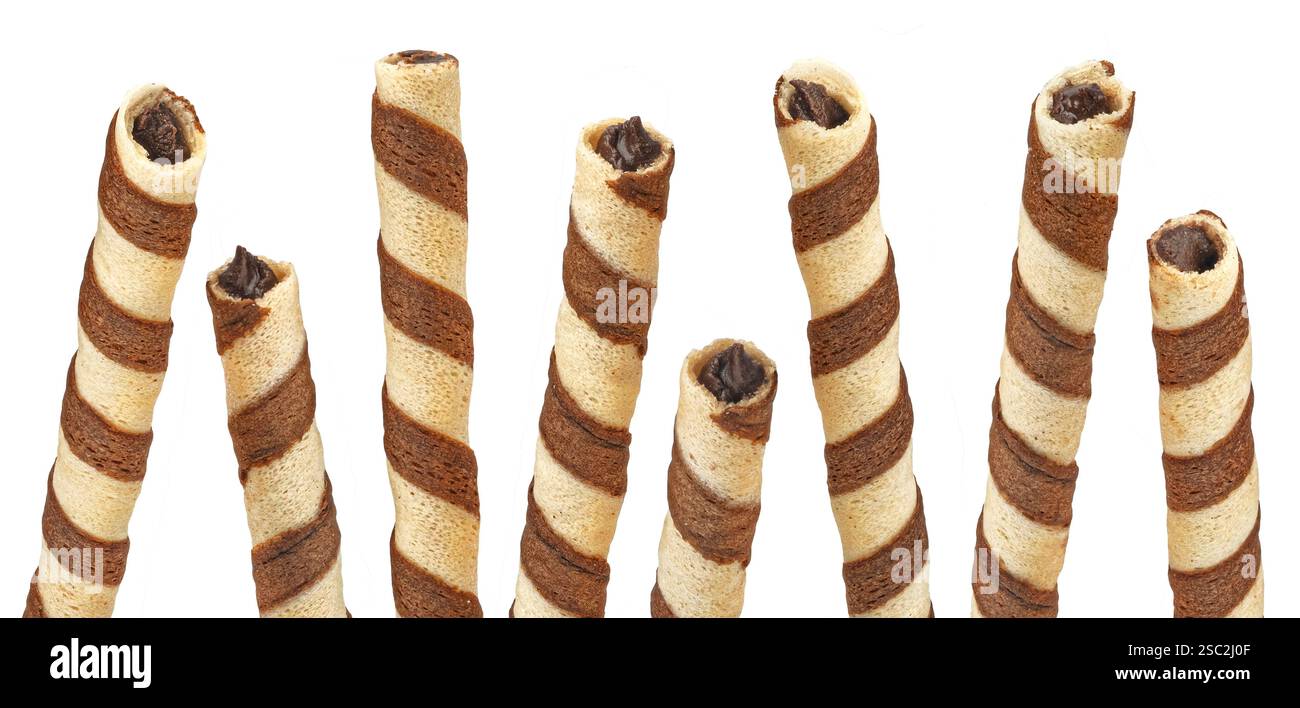 Waffle rolls, striped chocolate and vanilla wafer sticks isolated on ...