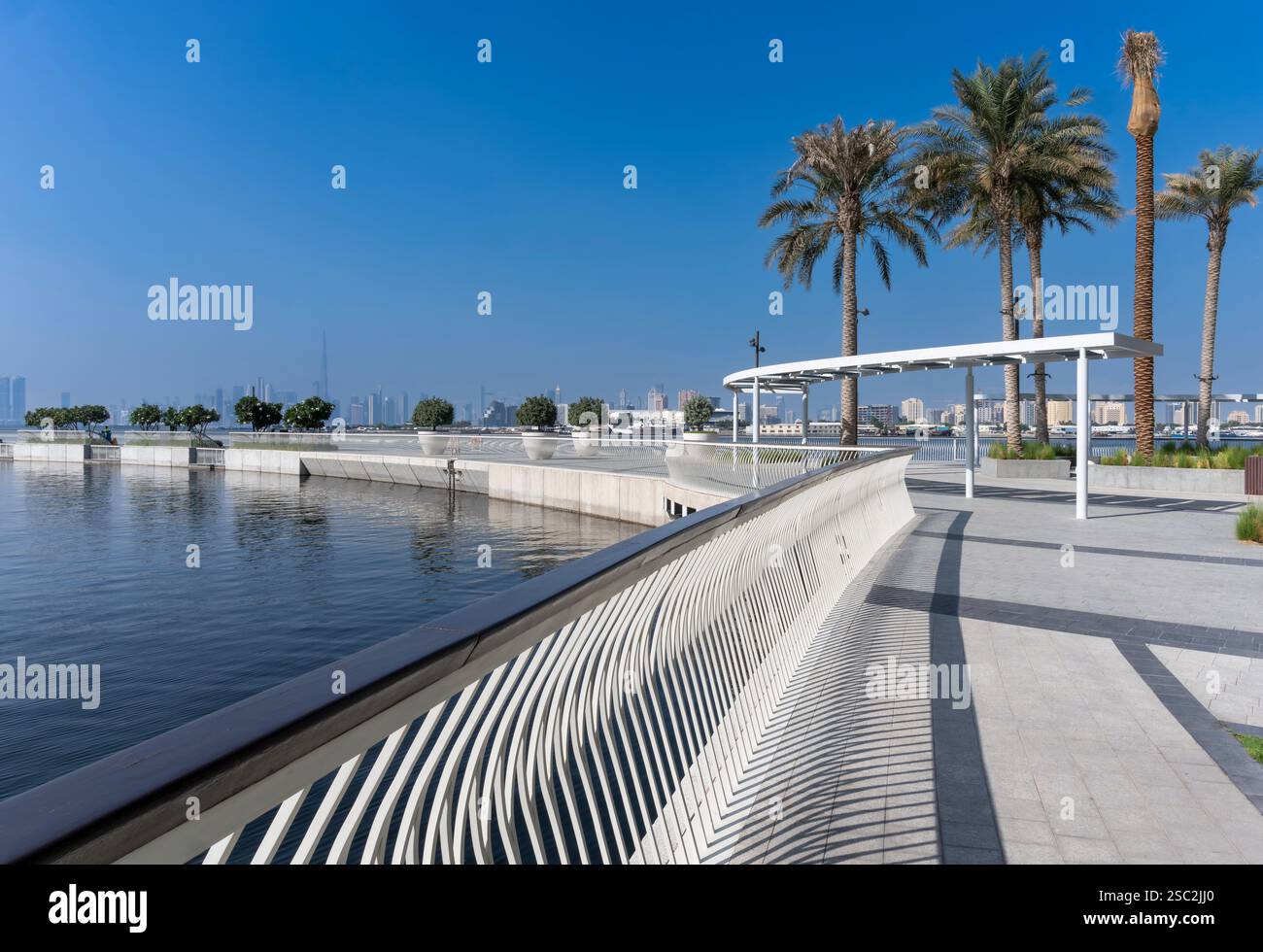 Sculptural walkway on the water's edge at Dubai Creek Harbour Marina ...