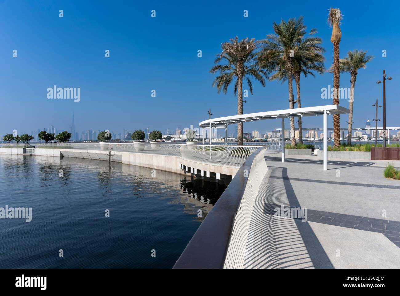 Sculptural walkway on the water's edge at Dubai Creek Harbour Marina ...