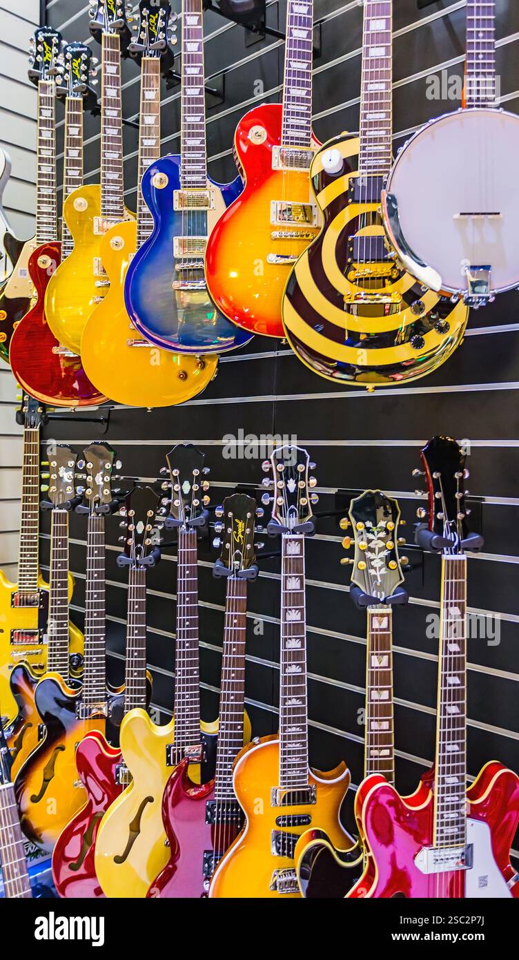 many guitars presented in a music store Stock Photo - Alamy