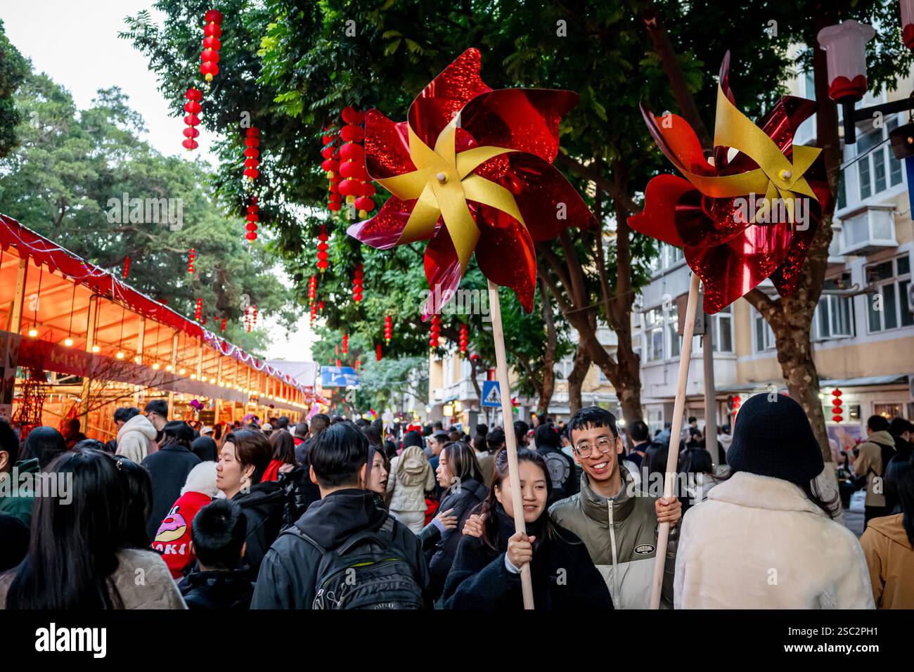 People flock to the a flower market in Guangzhou City, south China's ...