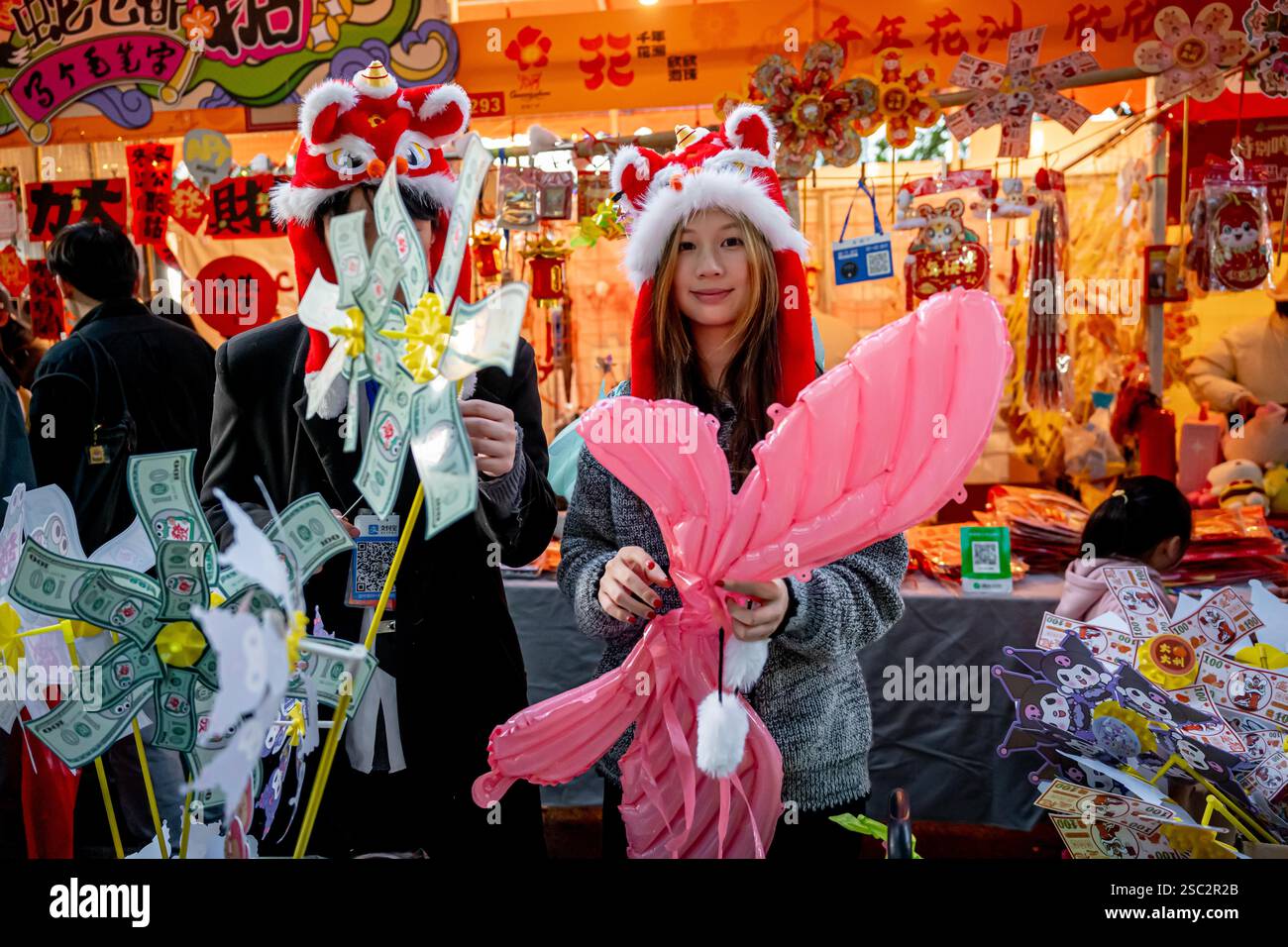 People flock to the a flower market in Guangzhou City, south China's ...