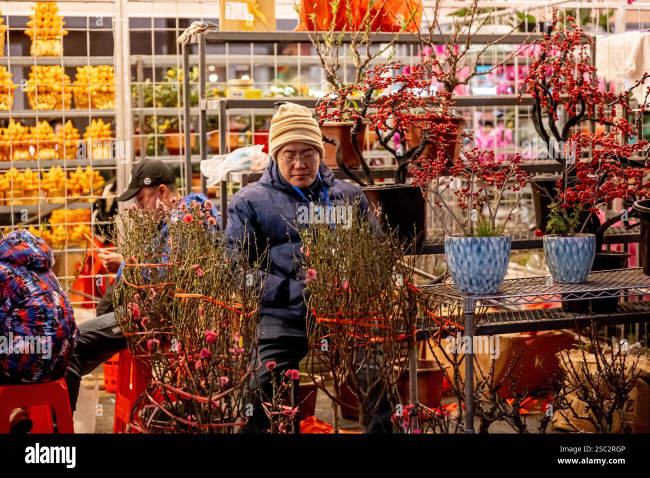 People flock to the a flower market in Guangzhou City, south China's ...