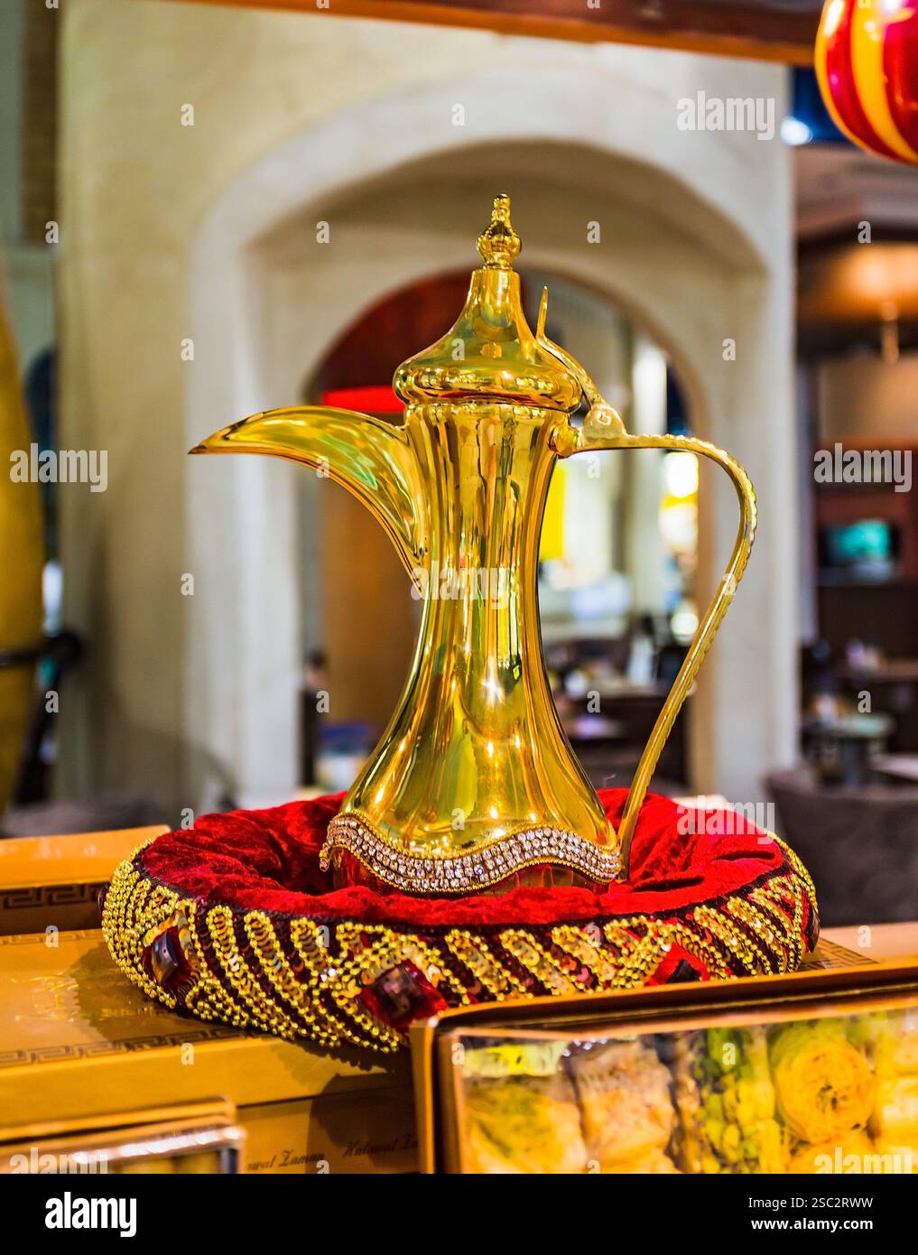 row of shiny traditional coffee pots at the souq in Dubai Stock Photo ...