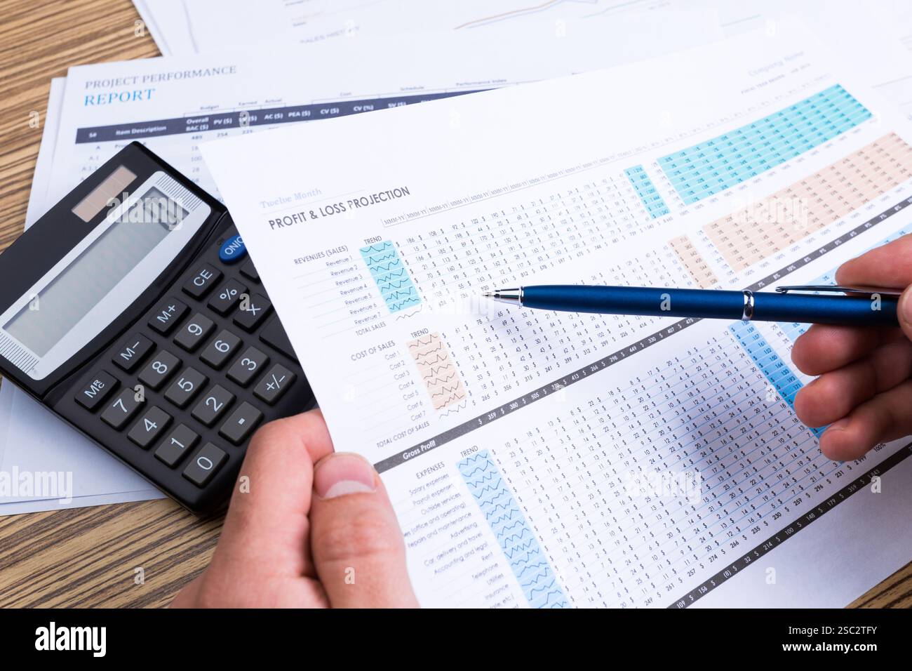 Graphs and Calculator Stock Photo - Alamy