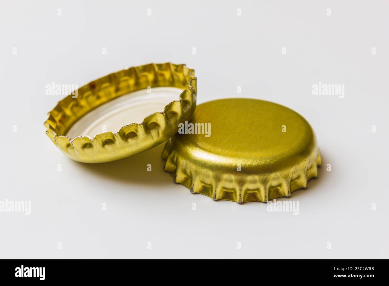 Two corks from beer and lemonade on white background Stock Photo - Alamy