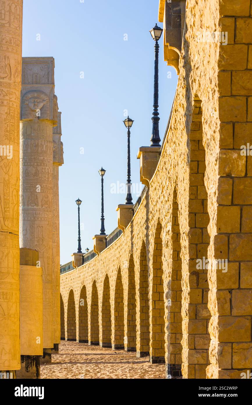 The arched stone colonnade with suspended lanterns Stock Photo - Alamy