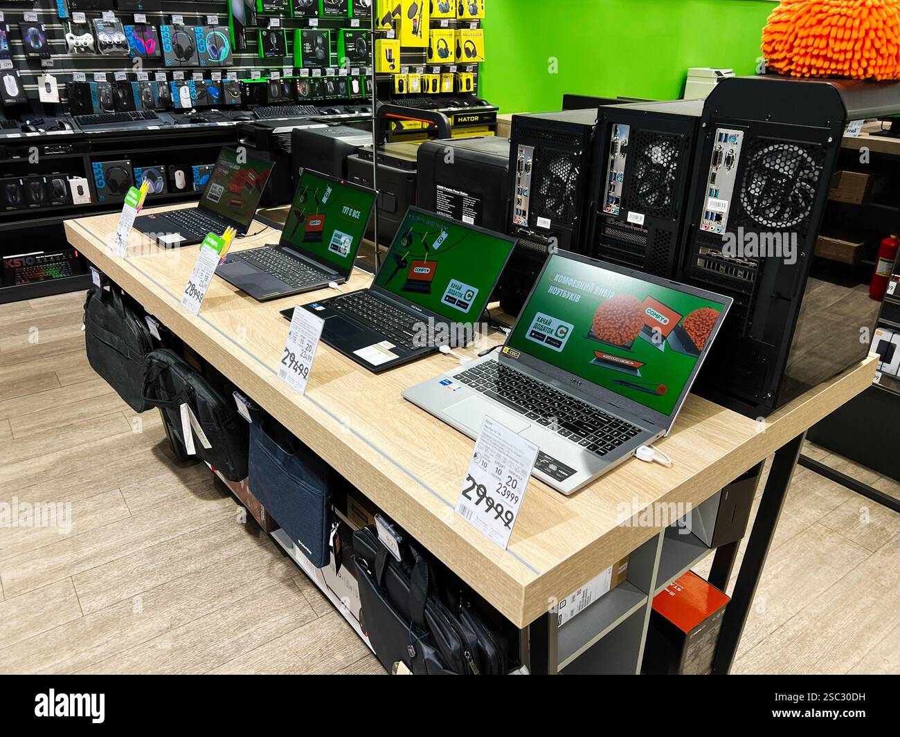 Kyiv, Ukraine - February 04, 2025: A showcase of laptops and desktop ...
