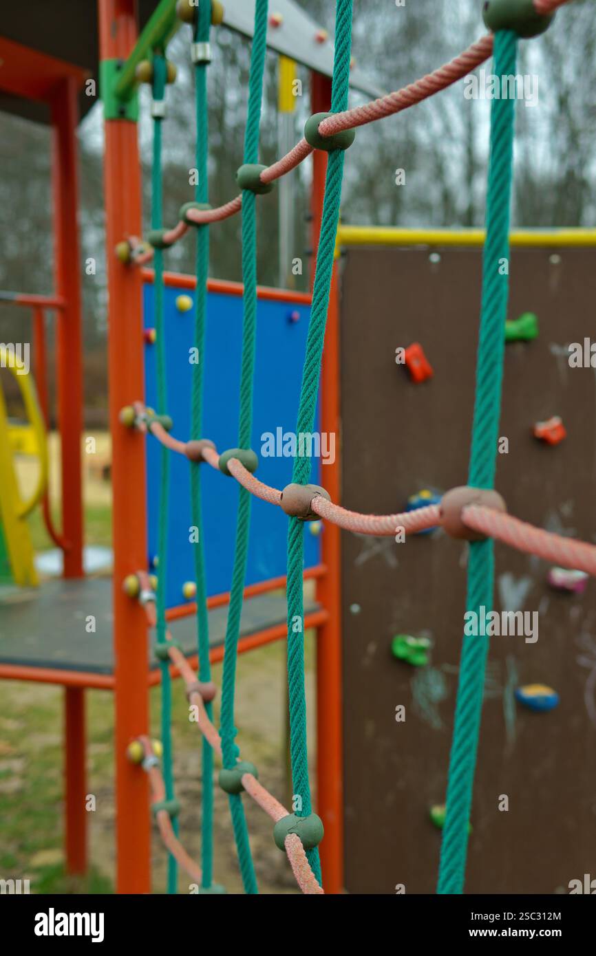 Colorful climbing net on the playground in Pole Mokotowskie Park ...