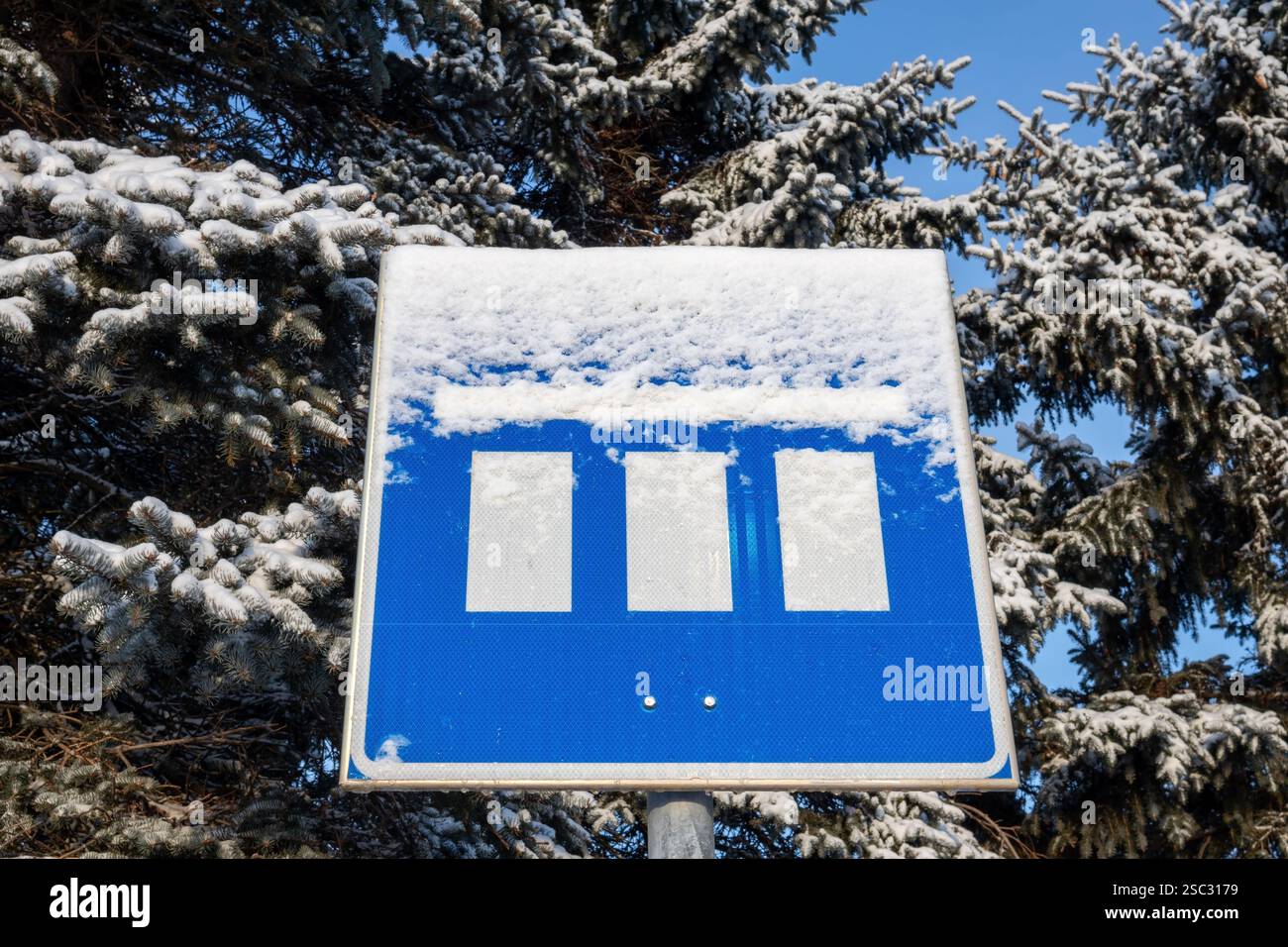 parking lot sign covered in snow in winter Stock Photo - Alamy