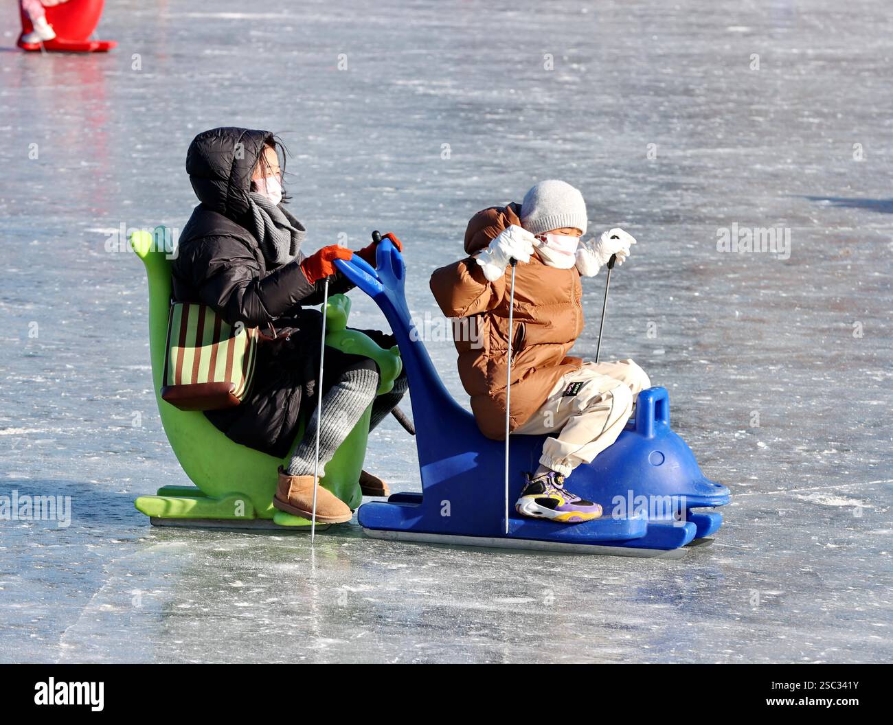 Visitors skate at an outdoor rink at Shichahai in Beijing, China, 28 ...