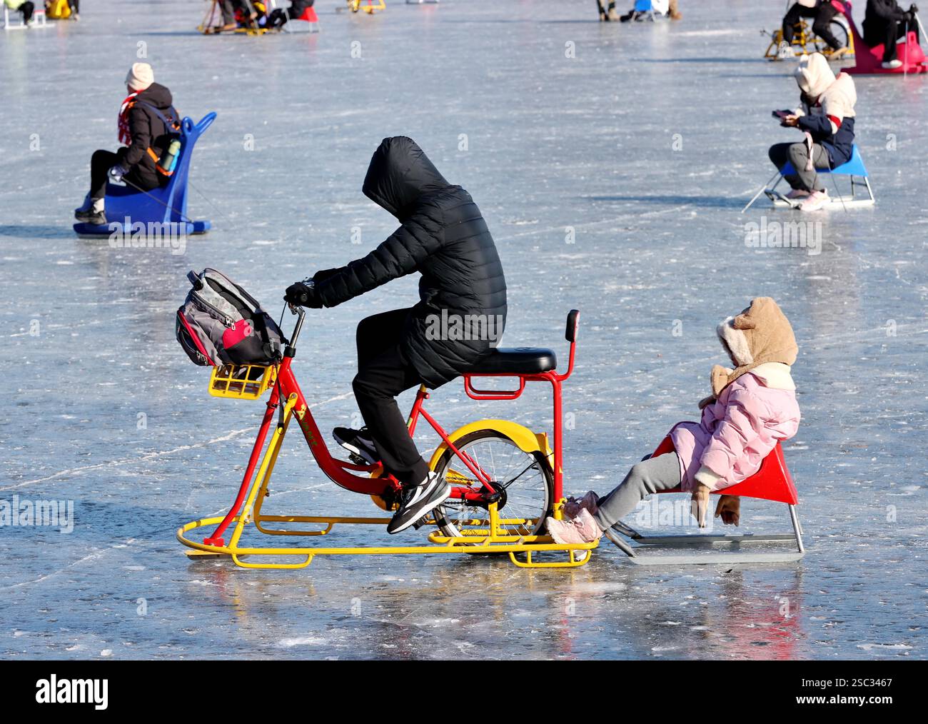 Visitors skate at an outdoor rink at Shichahai in Beijing, China, 28 ...