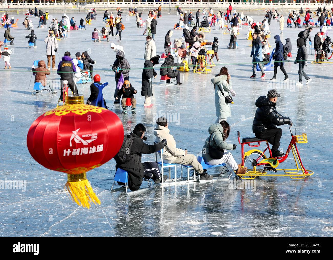Visitors skate at an outdoor rink at Shichahai in Beijing, China, 28 ...