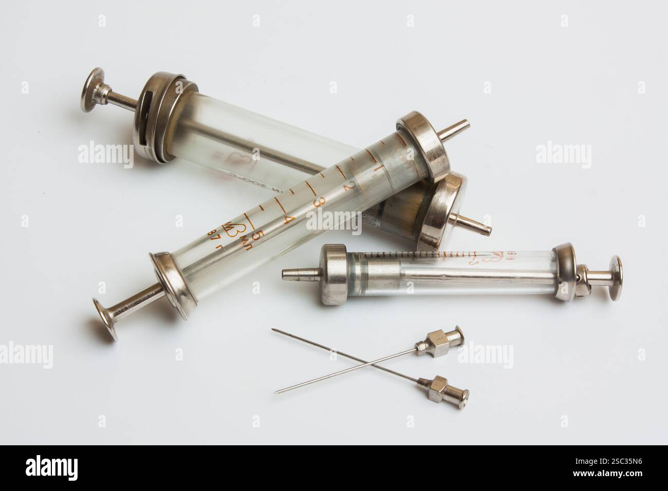 syringes old model on a white background Stock Photo - Alamy