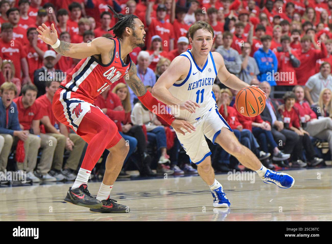 Kentucky guard Travis Perry (11) dribbles against Mississippi guard Dre ...