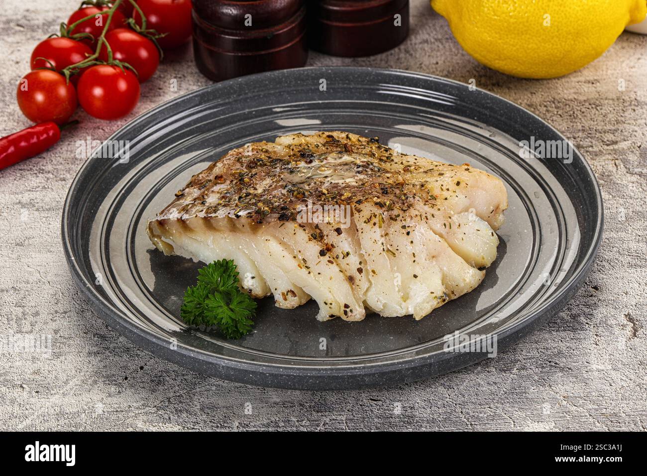 Dietary Baked cod fish fillet with spices Stock Photo - Alamy